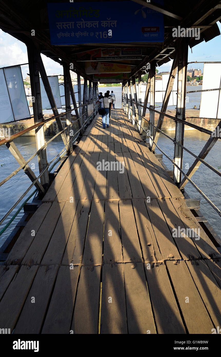 Passenger boats and jetty on Hooghly river, Kolkata, West Bengal, India ...