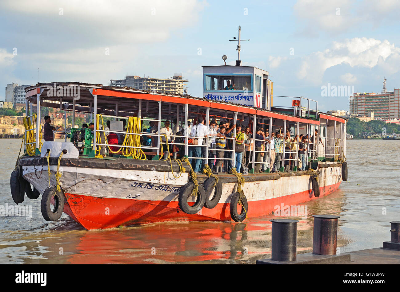 Passenger boats and jetty on Hooghly river, Kolkata, West Bengal, India ...