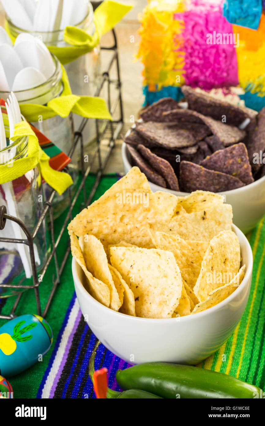 Fiesta party buffet table with tortilla chips and other traditional ...