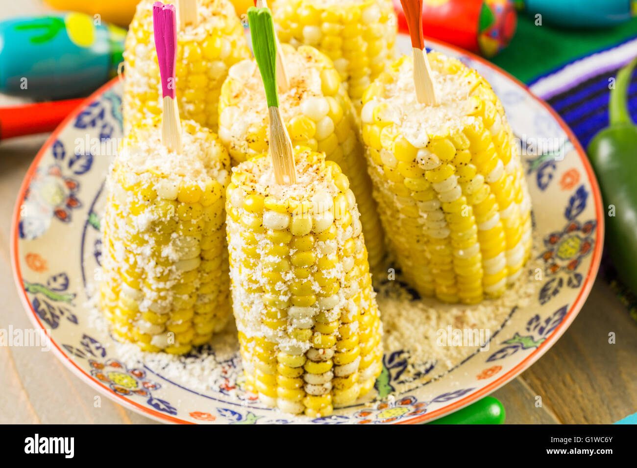 Fiesta party buffet table with spicy mexican corn on the cob and other ...