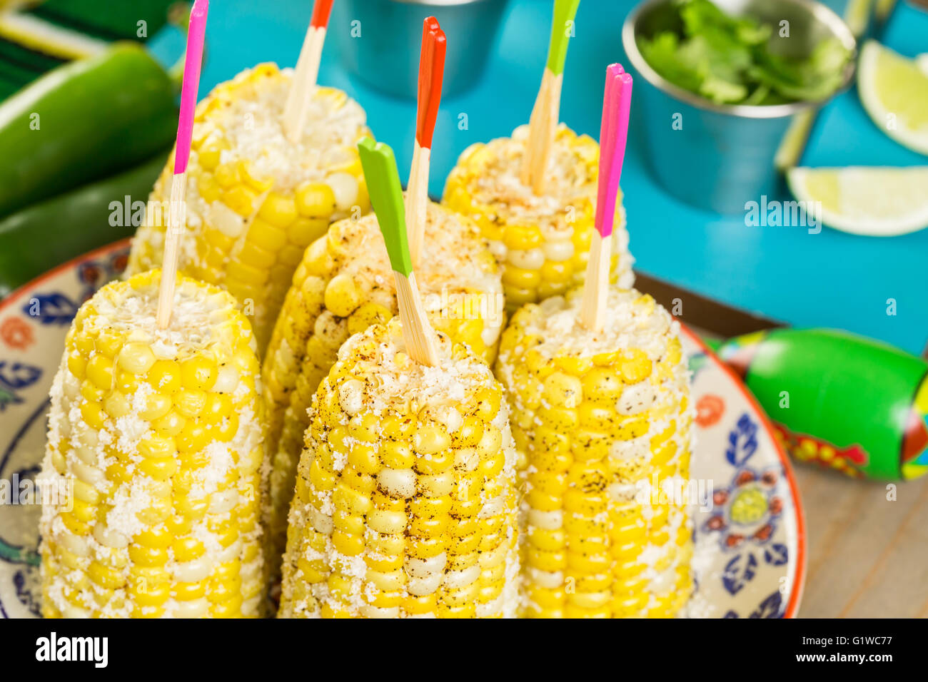 Fiesta party buffet table with spicy mexican corn on the cob and other ...