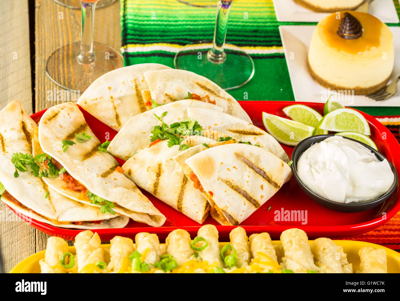 Fiesta party buffet table with chicken quesadilla and other traditional ...