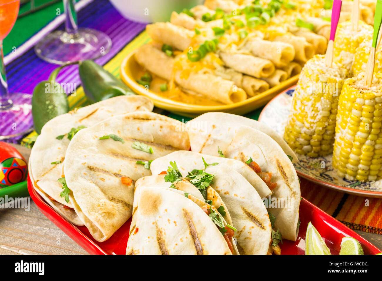 Fiesta party buffet table with chicken quesadilla and other traditional ...