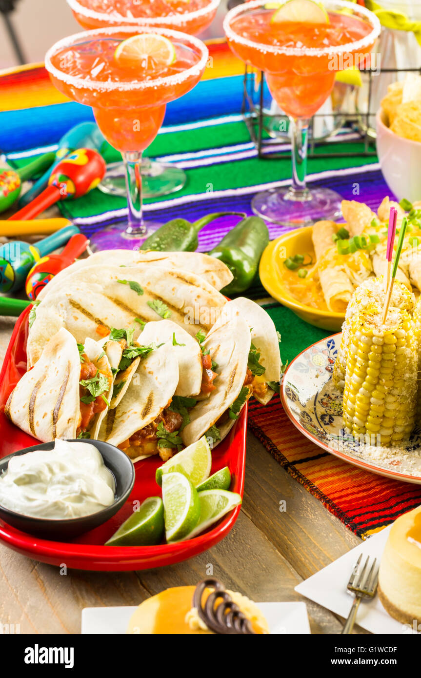 Fiesta party buffet table with chicken quesadilla and other traditional ...