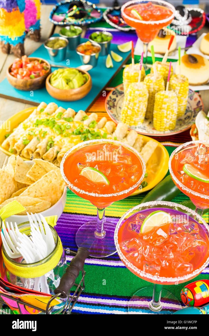 Fiesta party buffet table with watermelon margaritas and other ...