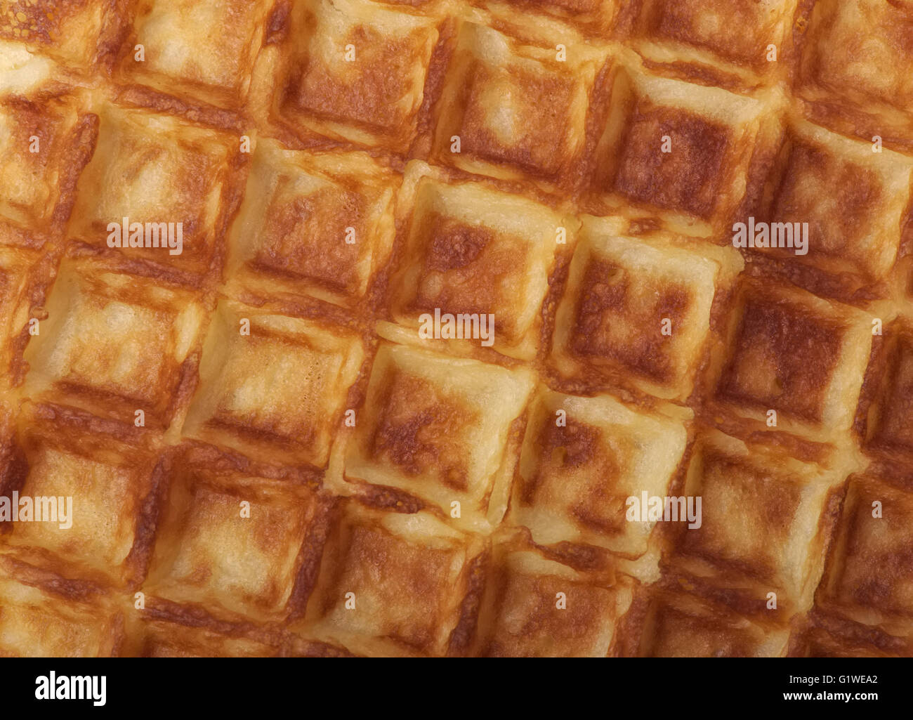 Freshly baked waffle, background Stock Photo - Alamy
