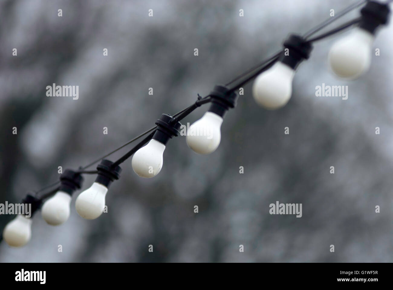 String of white lamps Stock Photo - Alamy