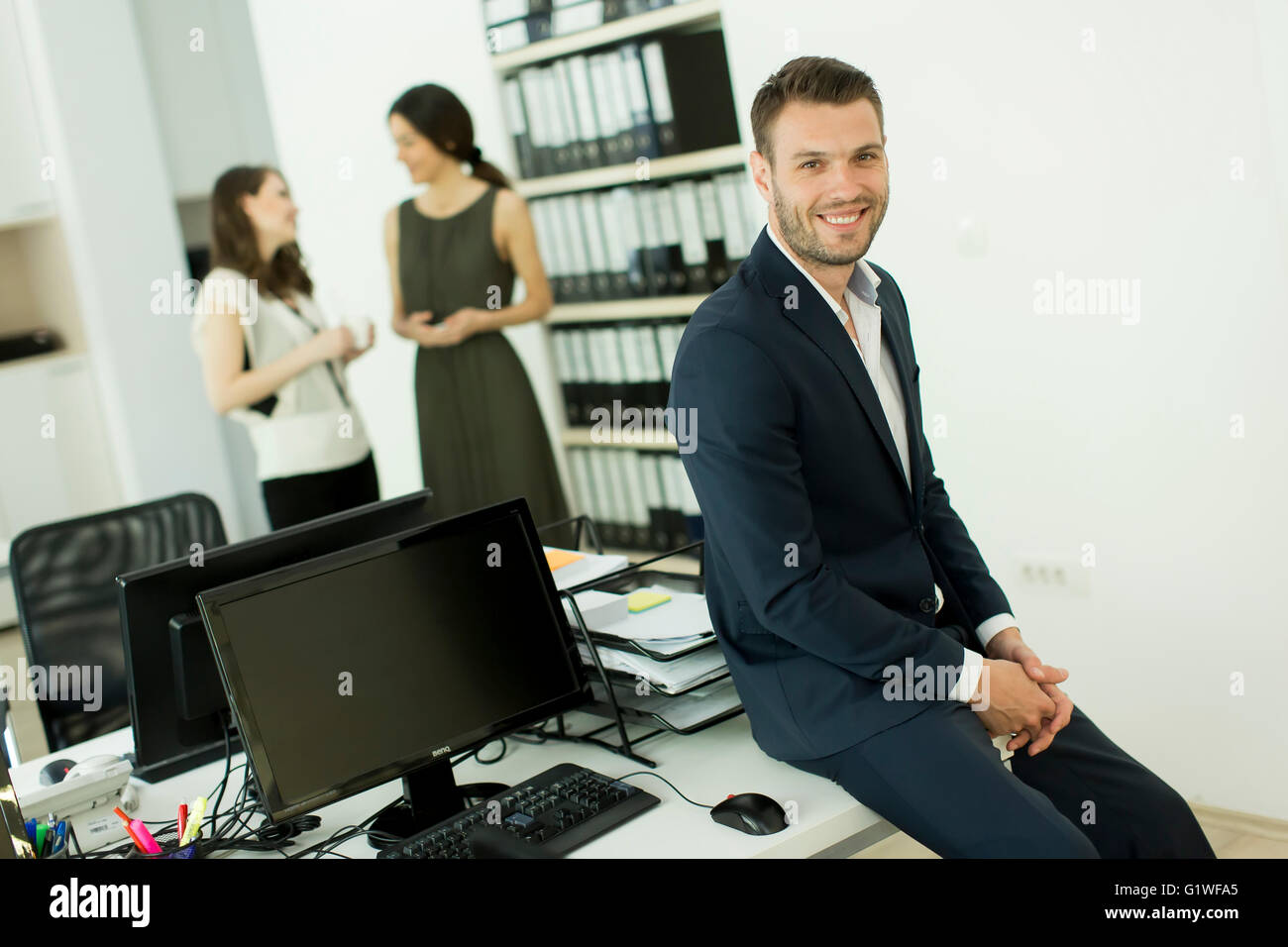 View of the man sitting in the office Stock Photo - Alamy