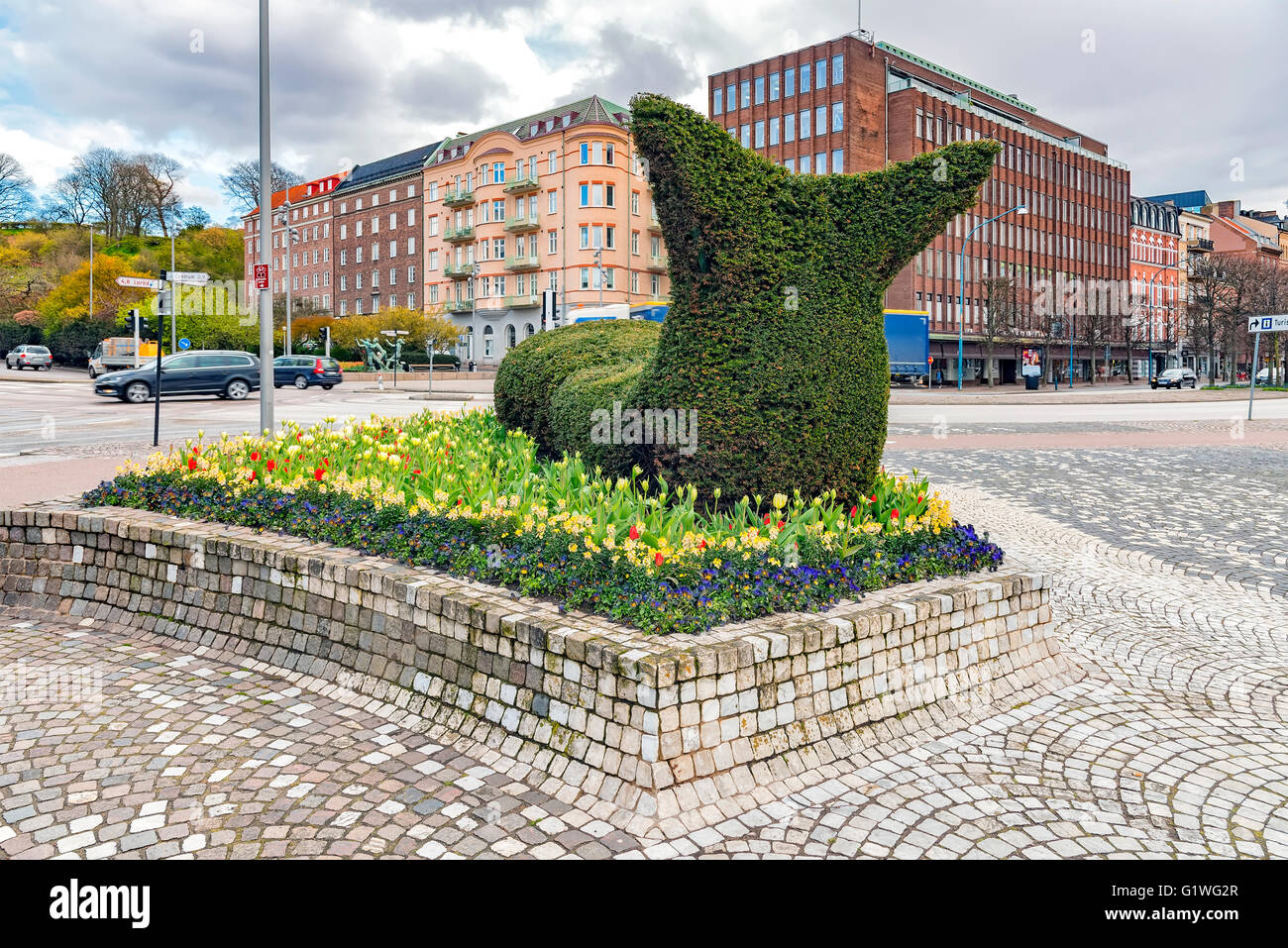 A hedge sculpture in the shape of a slug in the city center of ...