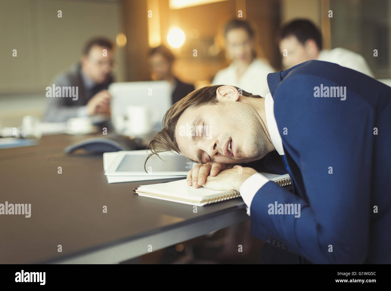 Businessman sleeping in conference room meeting Stock Photo - Alamy