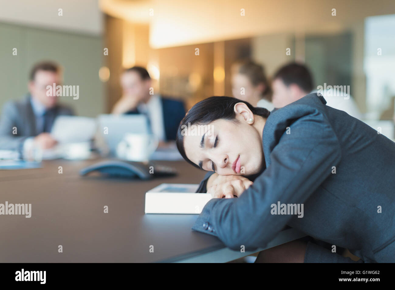 Businesswoman sleeping in conference room meeting Stock Photo - Alamy