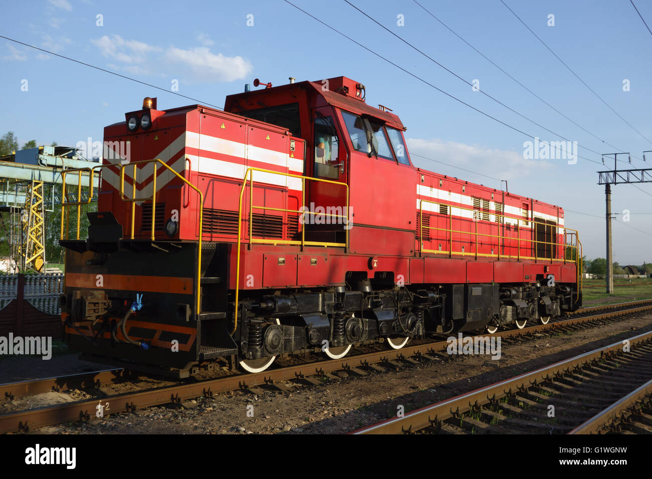 electric shunting locomotive red on spare rails Stock Photo - Alamy