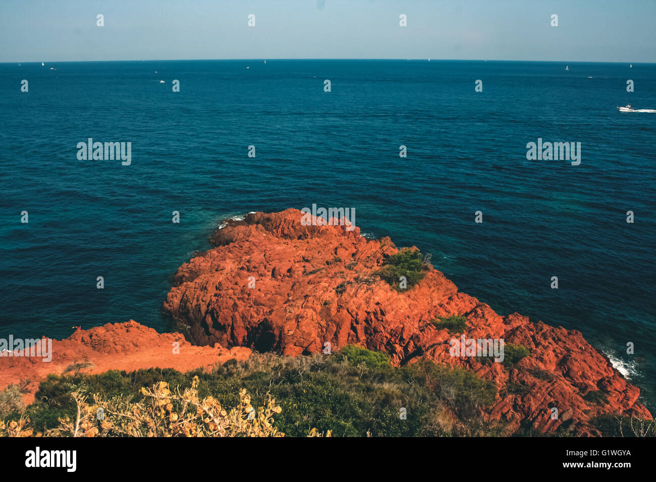 Red cliff and sea Stock Photo - Alamy