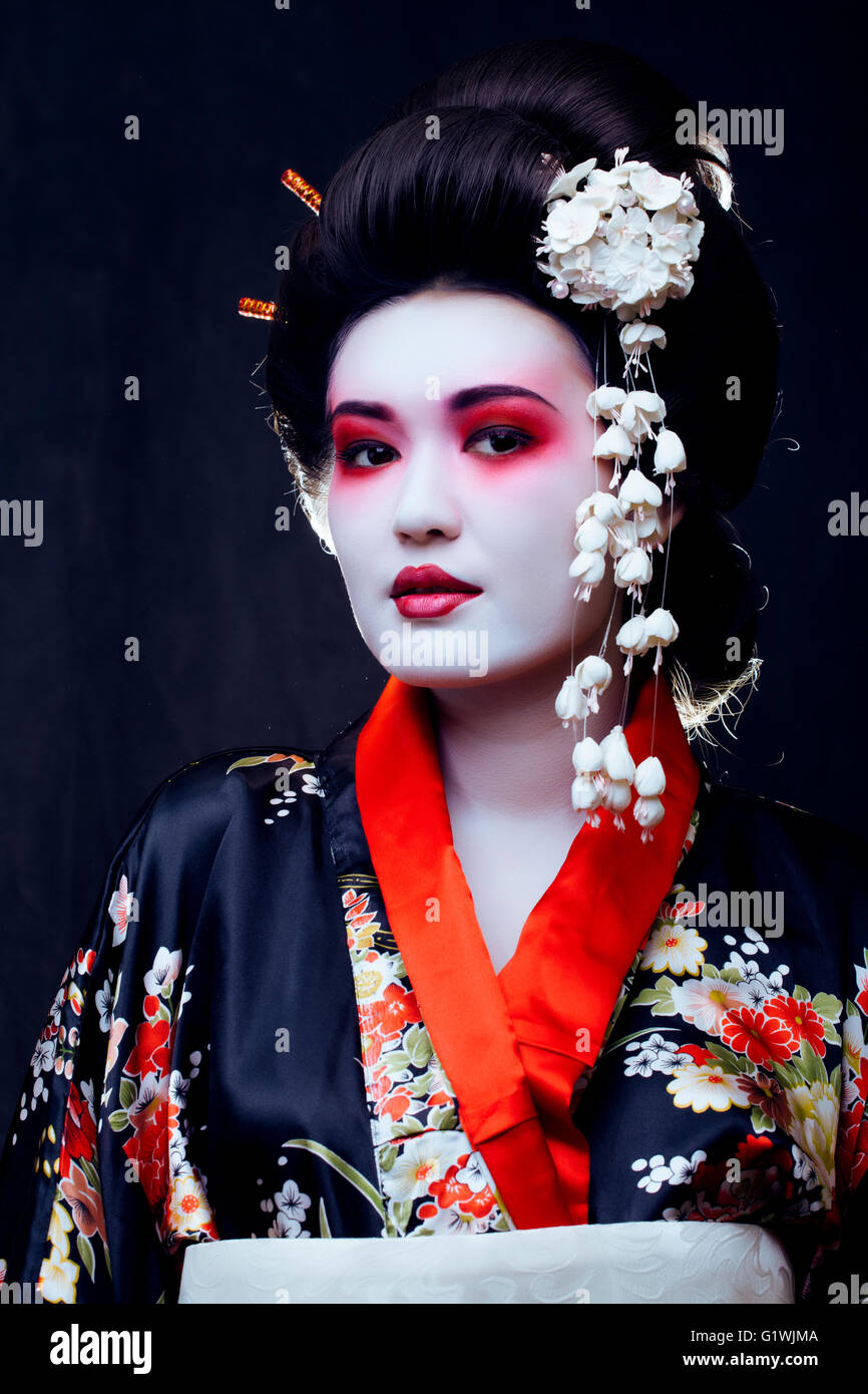 young pretty geisha in kimono with sakura and decoration Stock Photo ...