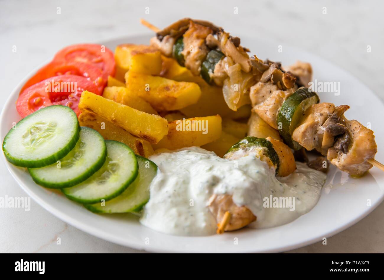 Traditional delicious chicken shish kebab with mushrooms. Served with ...