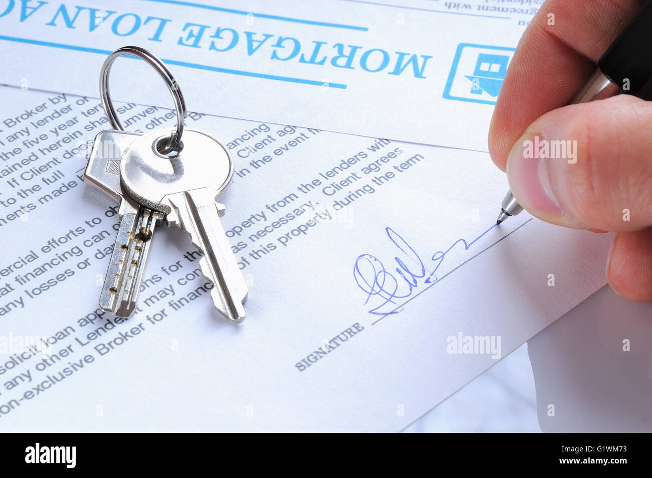 client signing the mortgage loan agreement upon delivery of the keys to ...