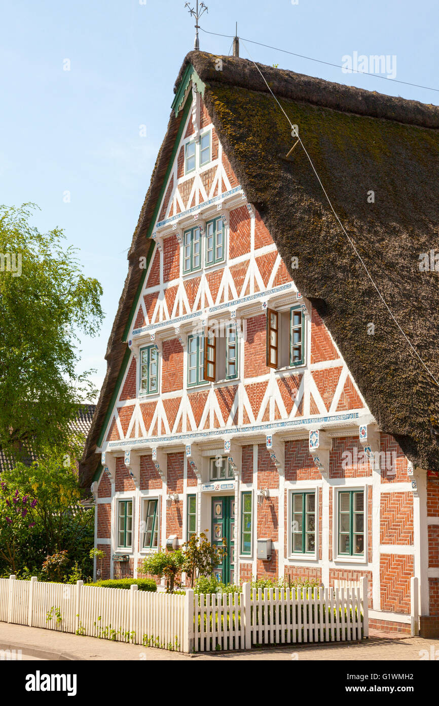 Typical half-timbered thatched roof farm house at the Altes Land region ...