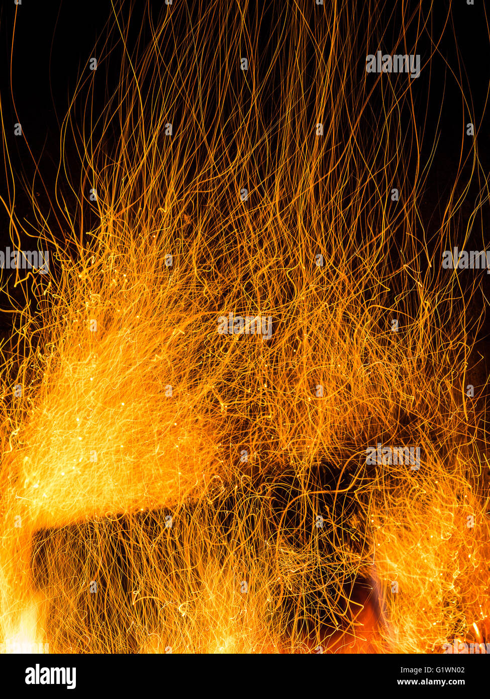 Sparks and embers from a log fire Stock Photo - Alamy