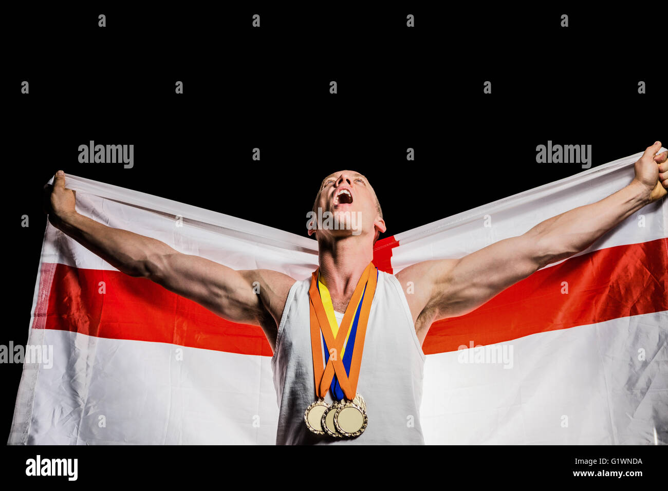 Athlete posing with gold medals after victory Stock Photo - Alamy