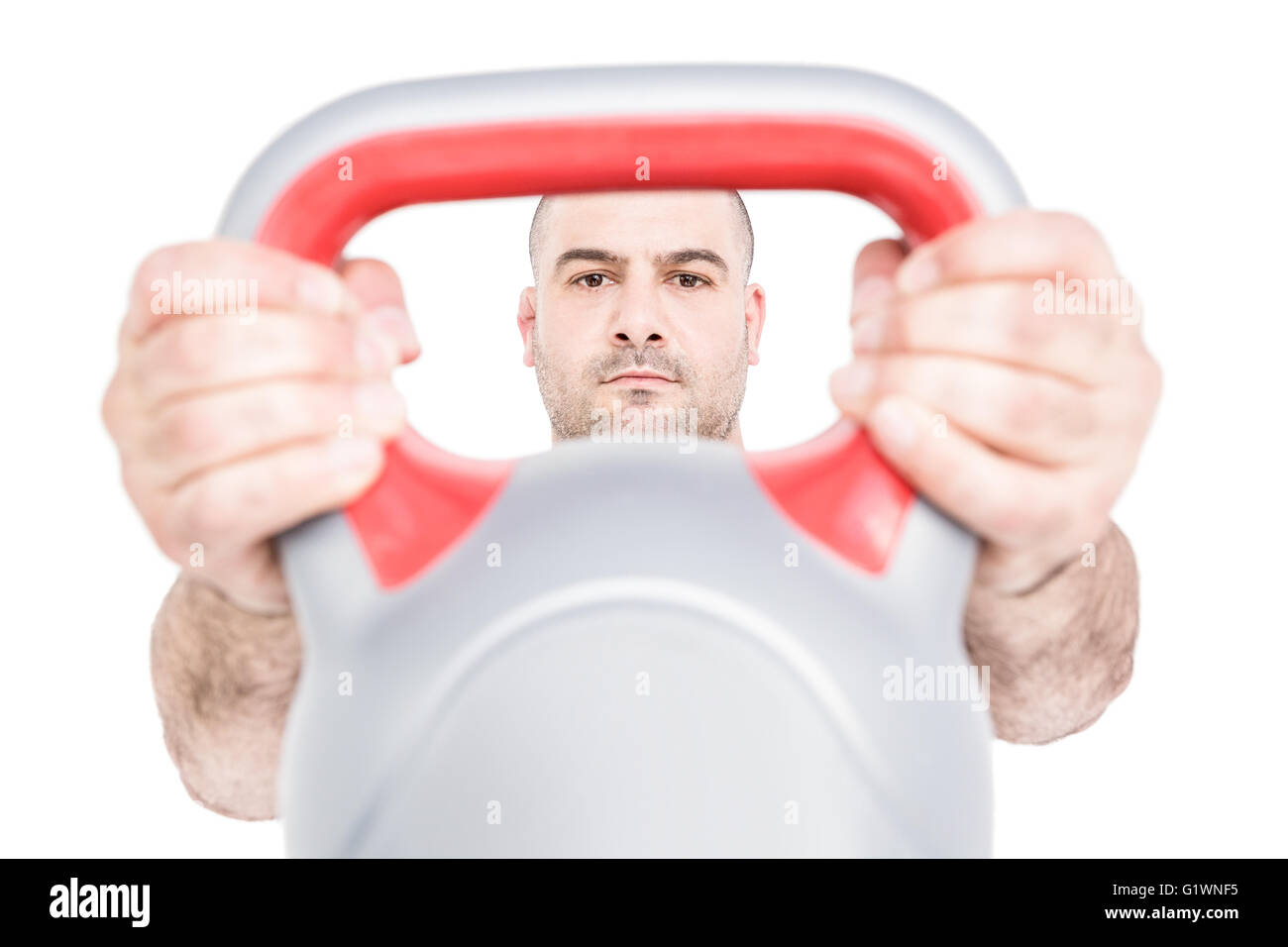 Bodybuilder lifting heavy kettlebell Stock Photo - Alamy