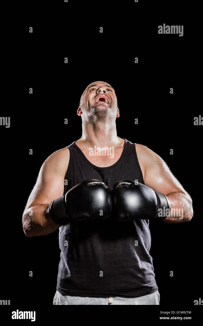 Boxer in boxing gloves laughing Stock Photo - Alamy