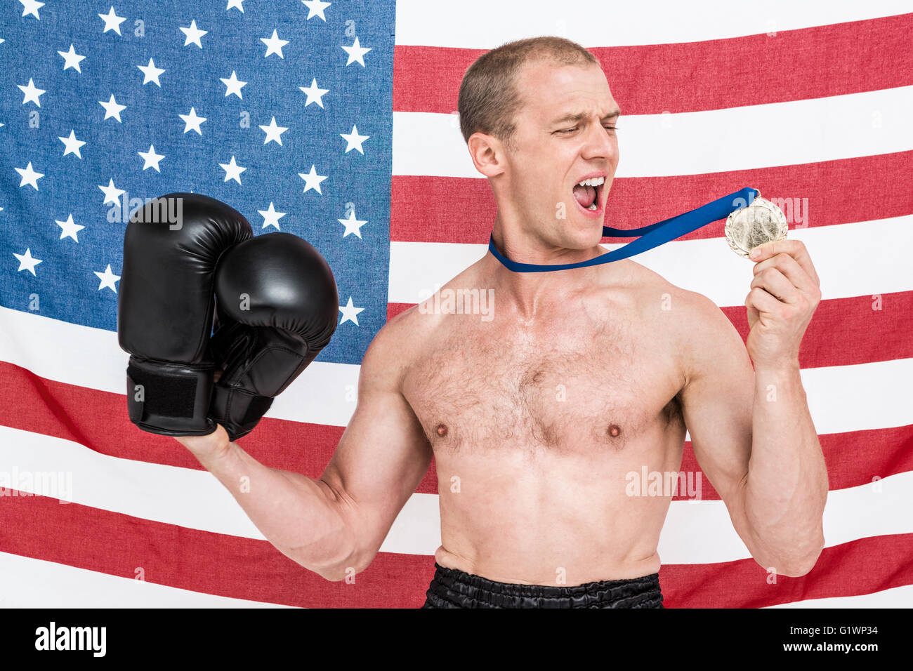 Excited boxer looking at his gold medal Stock Photo - Alamy
