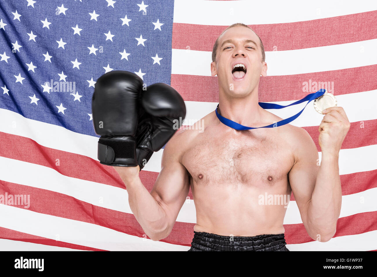Excited boxer showing his gold medal Stock Photo - Alamy