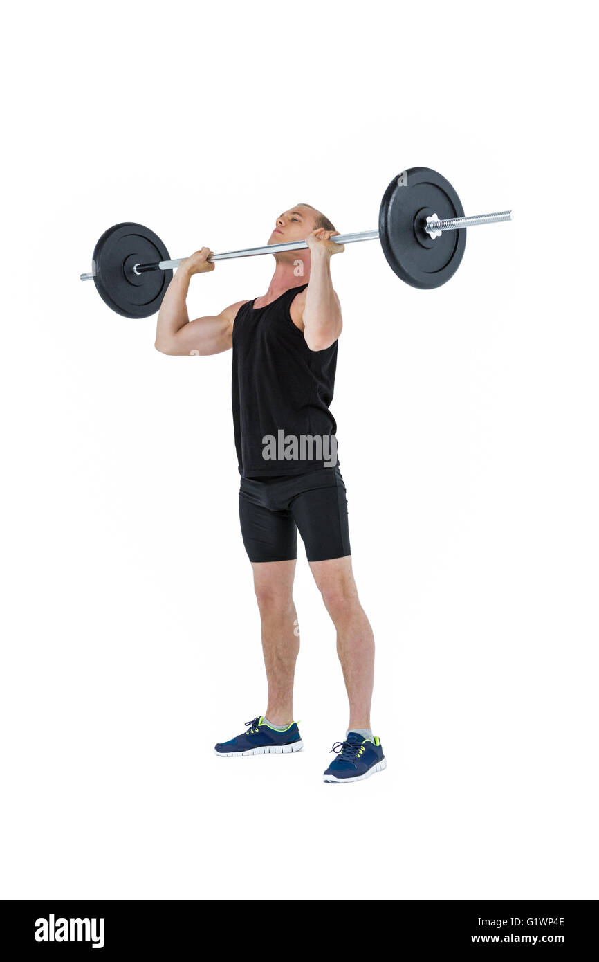 Bodybuilder lifting heavy barbell weights Stock Photo - Alamy