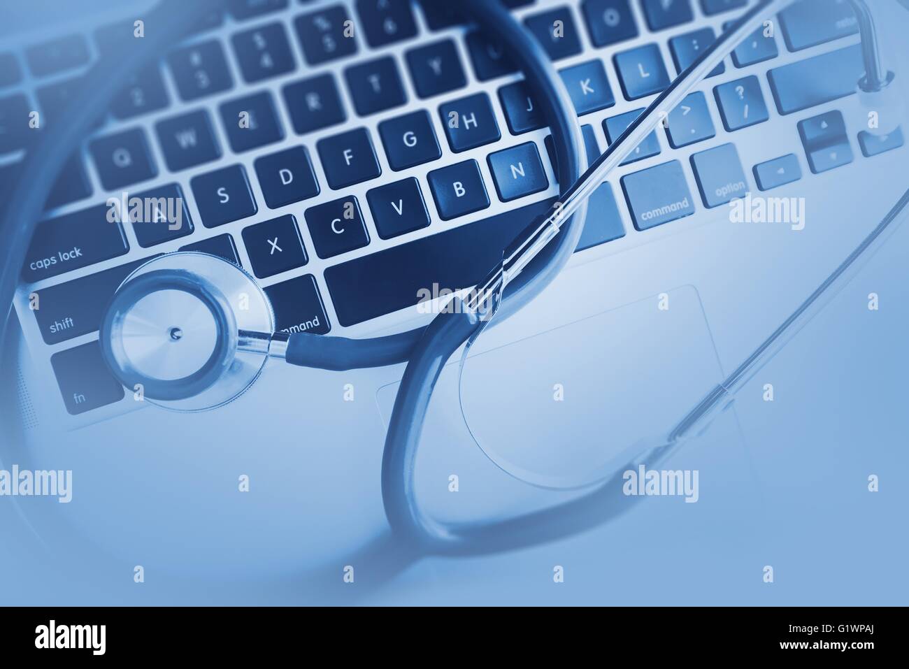 Laptop Computer and Stethoscope in Doctor Office. Computerized Health ...