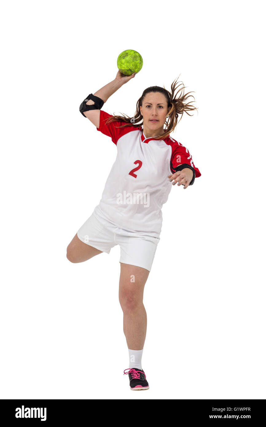 Sportswoman throwing a ball Stock Photo - Alamy