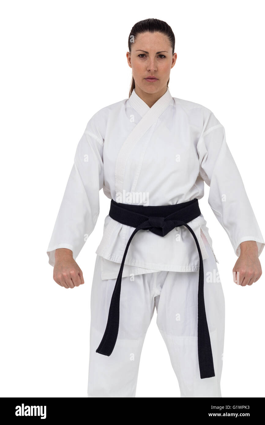 Female karate player posing on white background Stock Photo - Alamy
