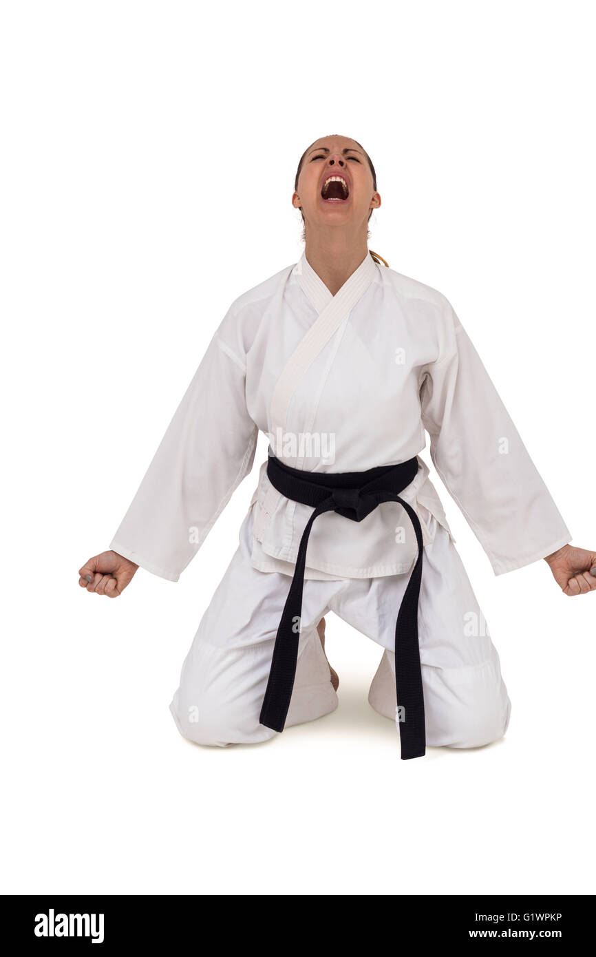 Female fighter posing after victory Stock Photo - Alamy