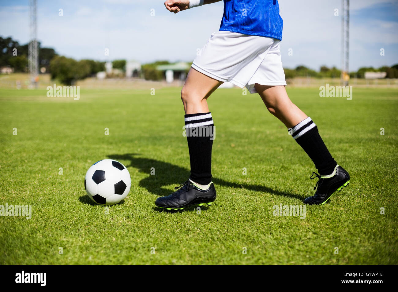 Female football player practicing soccer Stock Photo - Alamy