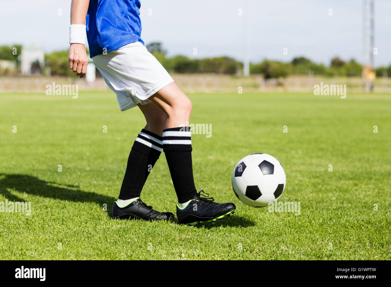 Female football player practicing soccer Stock Photo - Alamy