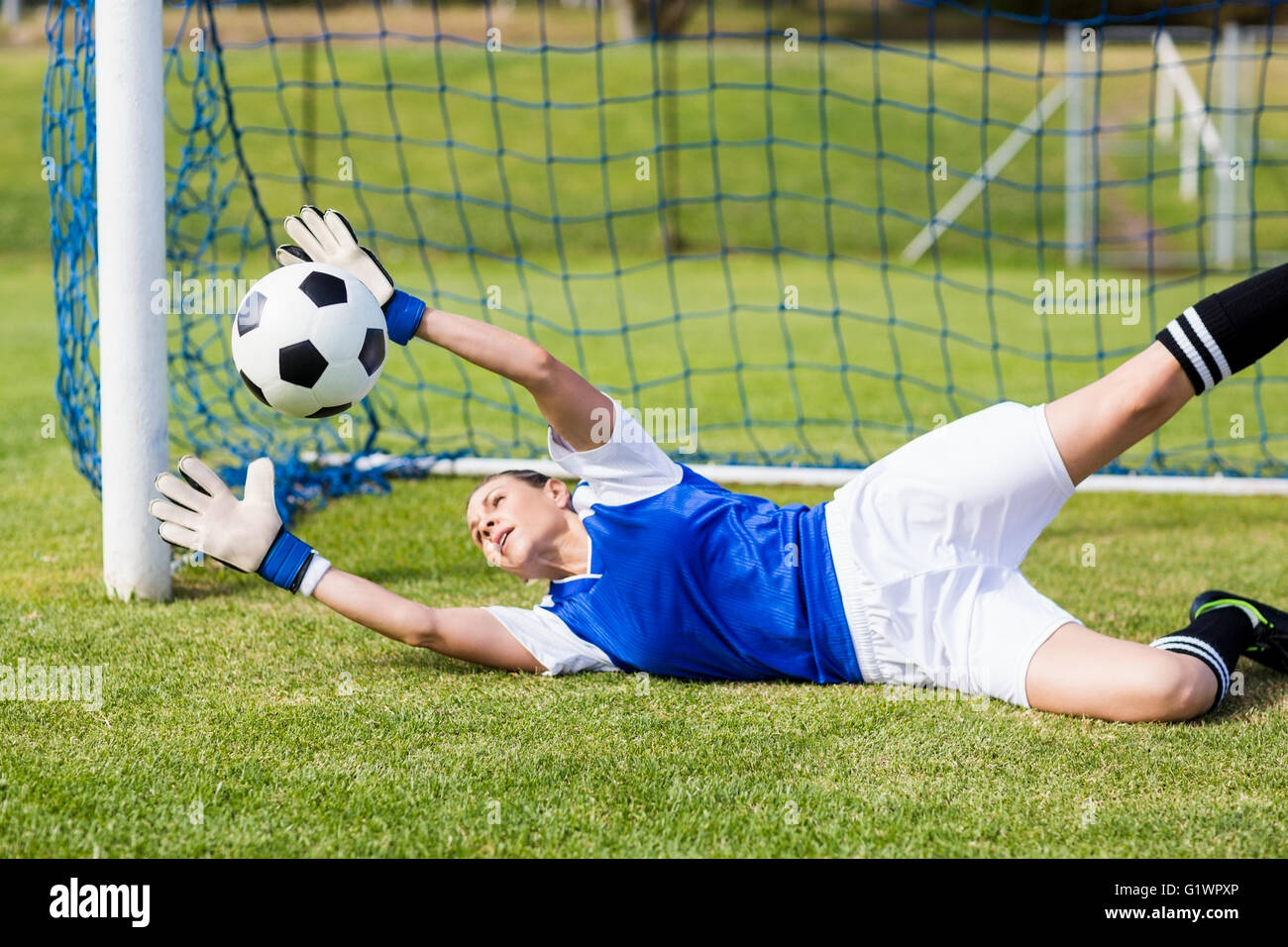 Female goalkeeper saving a goal Stock Photo - Alamy