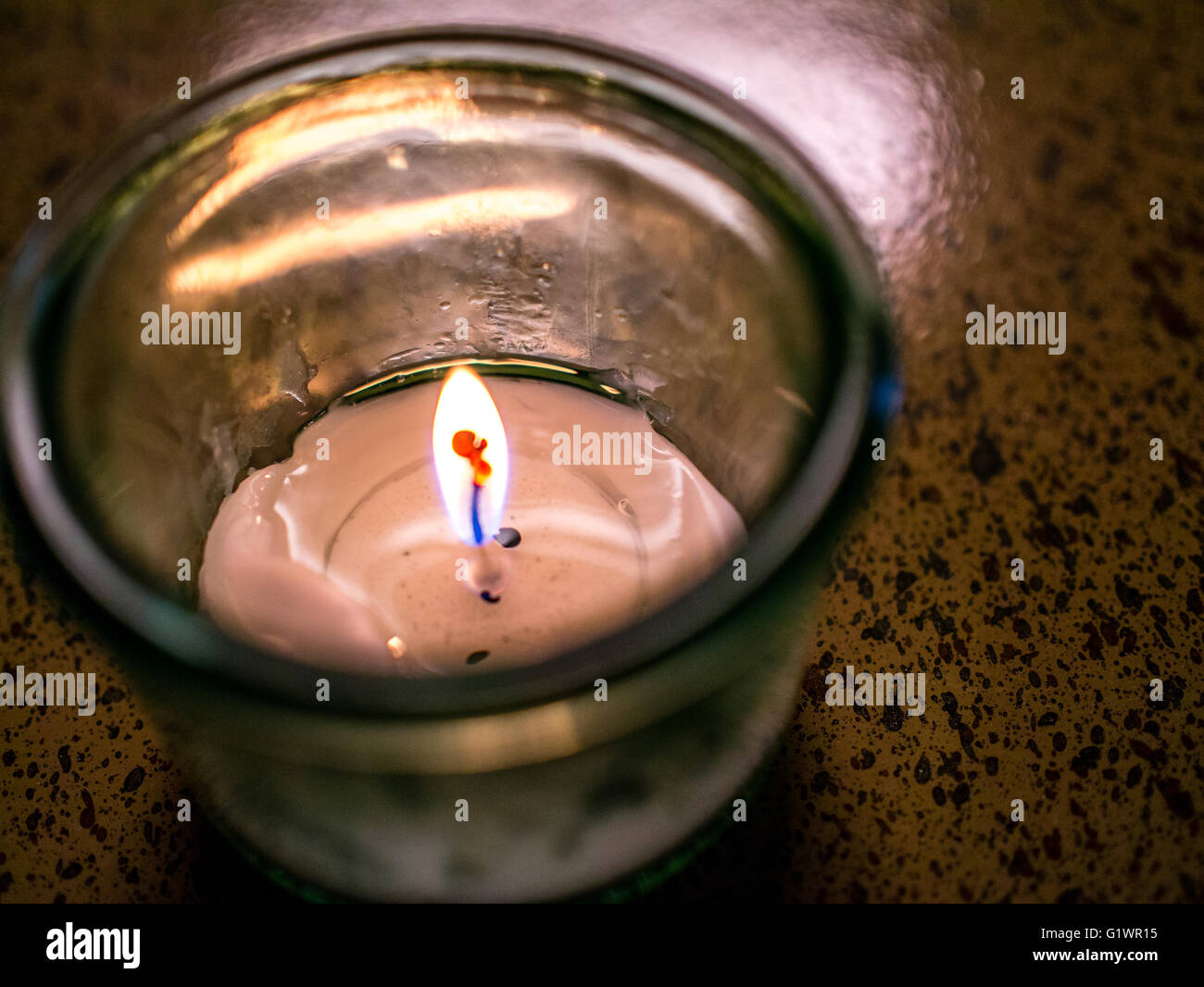 Single candle flame, blurred background Stock Photo - Alamy