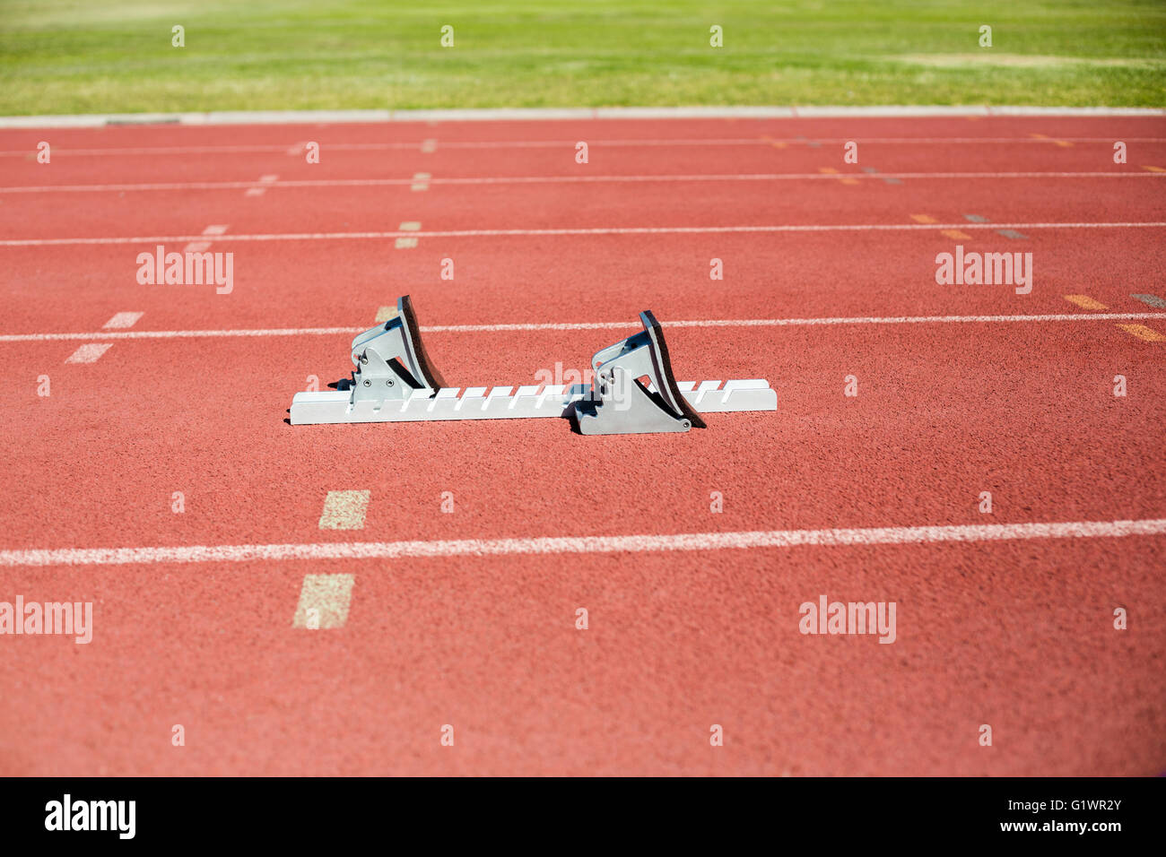 Starting block on a running track Stock Photo - Alamy