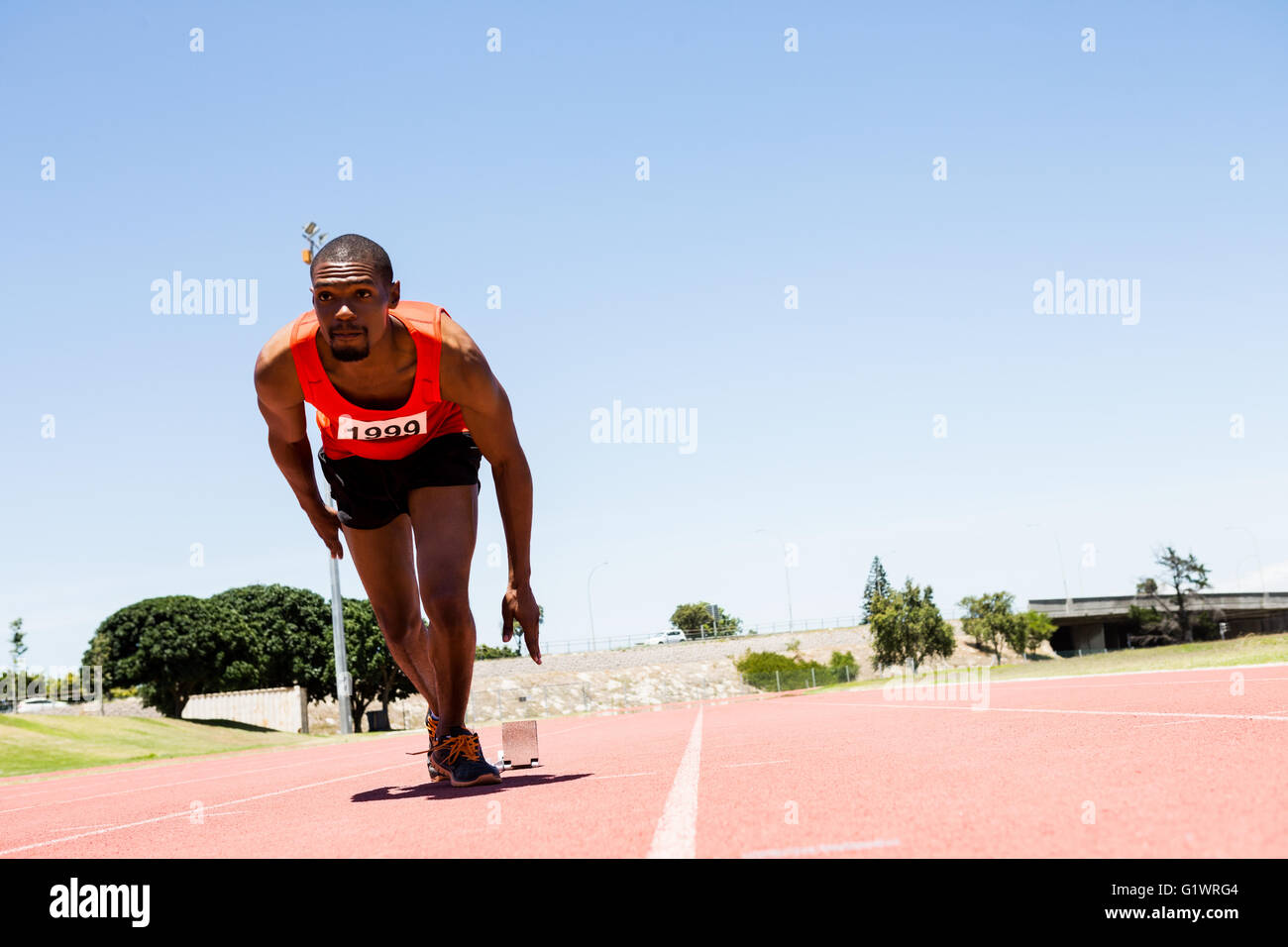 Athlete running on the racing track Stock Photo - Alamy