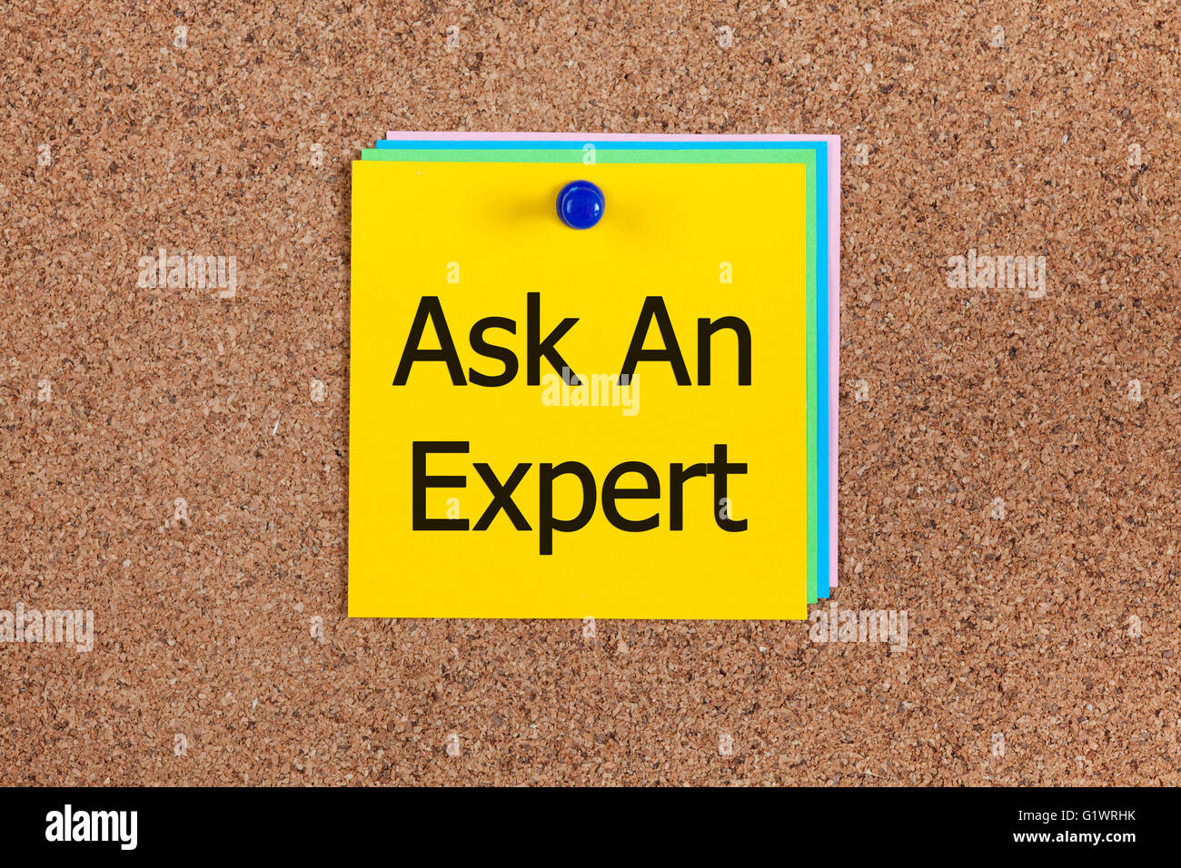 Post-it notes with words Ask An Expert on cork board Stock Photo - Alamy