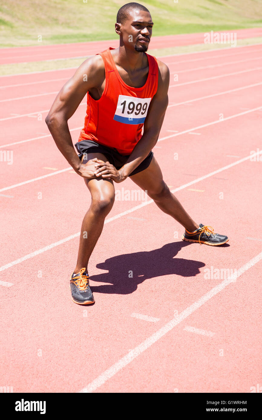 Athlete warming up on the running track Stock Photo - Alamy
