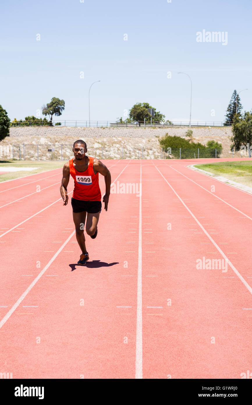 Athlete running on the racing track Stock Photo - Alamy