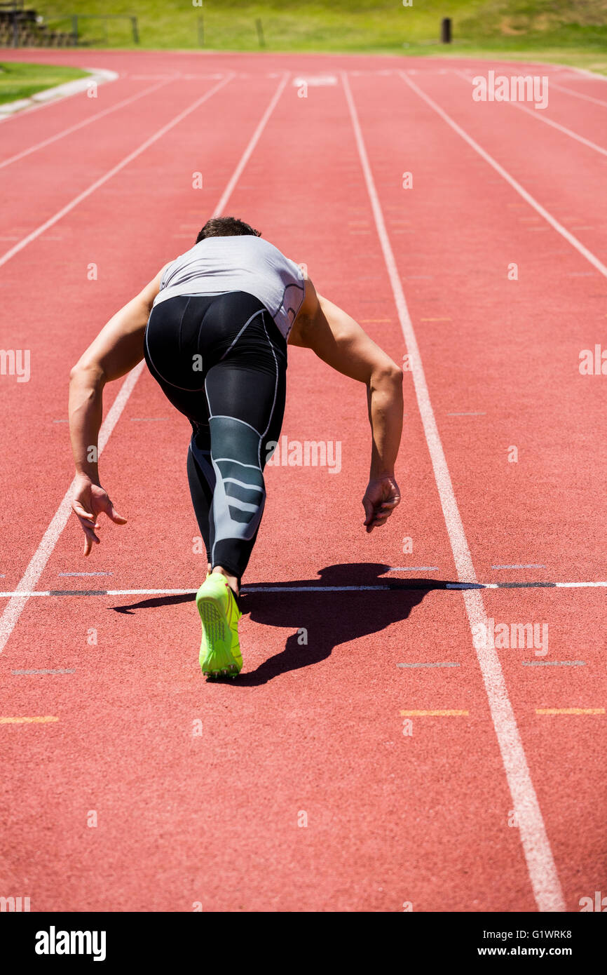 Athlete running on the running track Stock Photo - Alamy