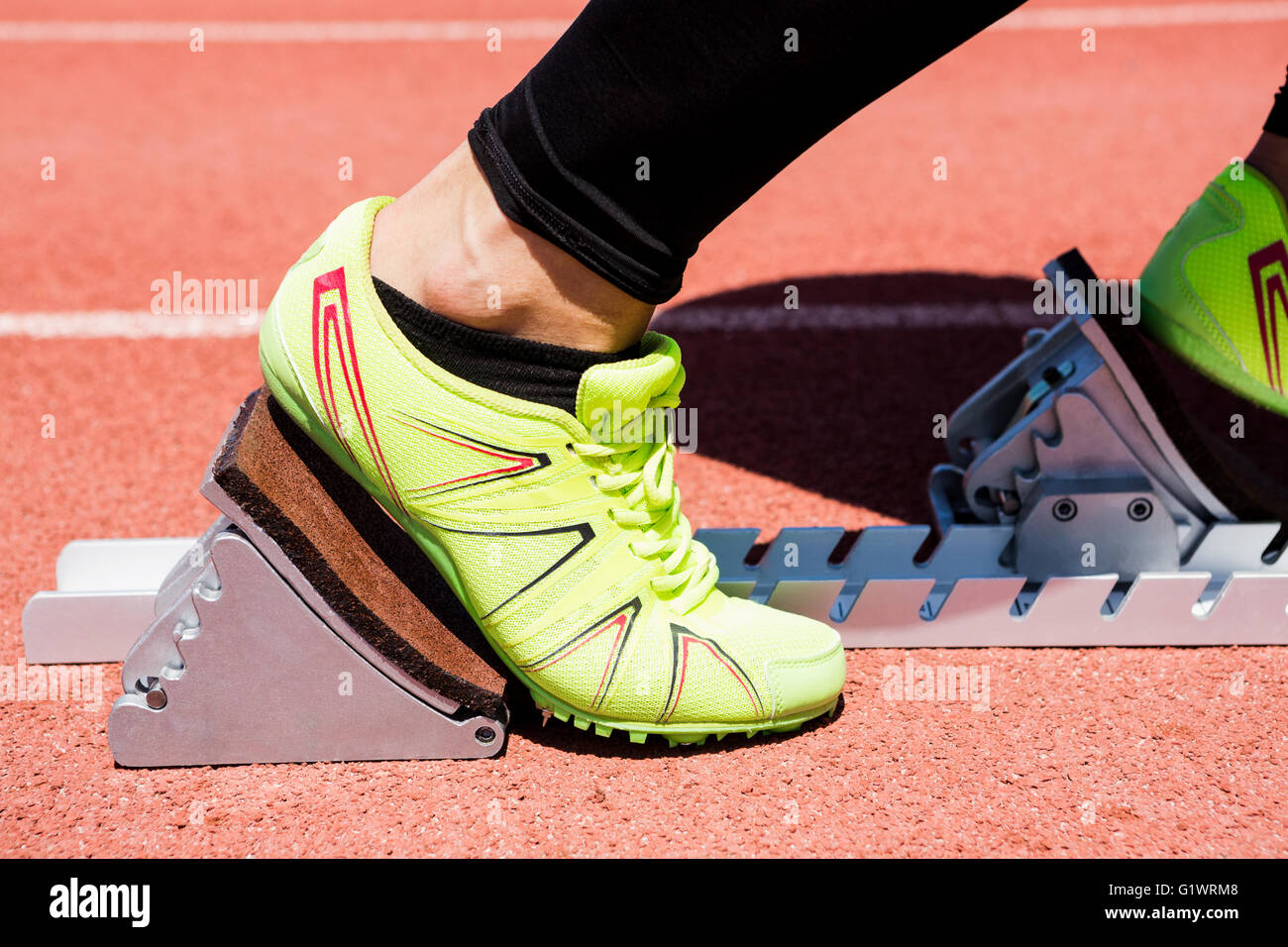 Athletes hands on a starting block Stock Photo - Alamy