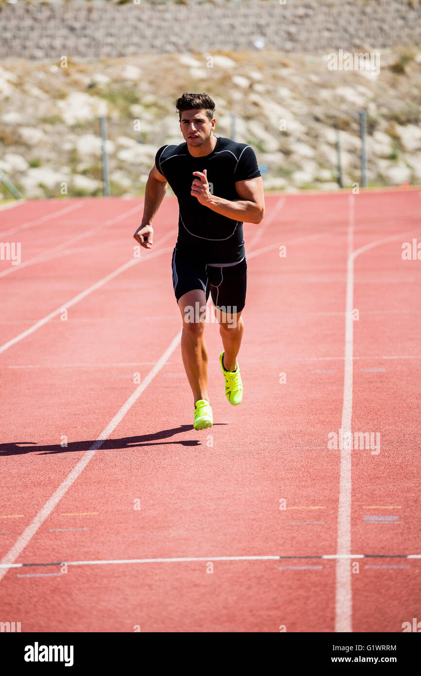 Athlete running on the racing track Stock Photo - Alamy