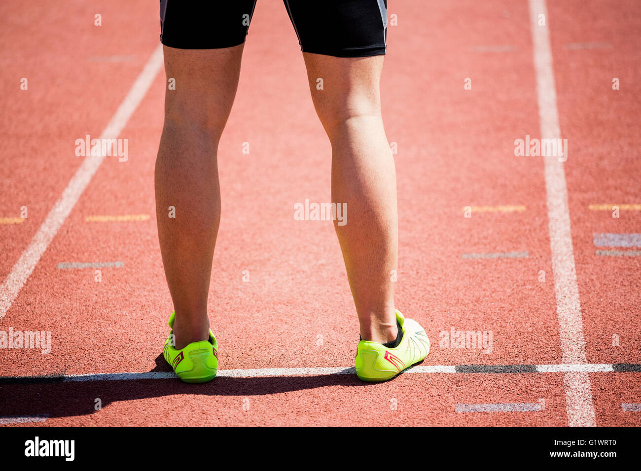 Feet of an athlete on running track Stock Photo - Alamy
