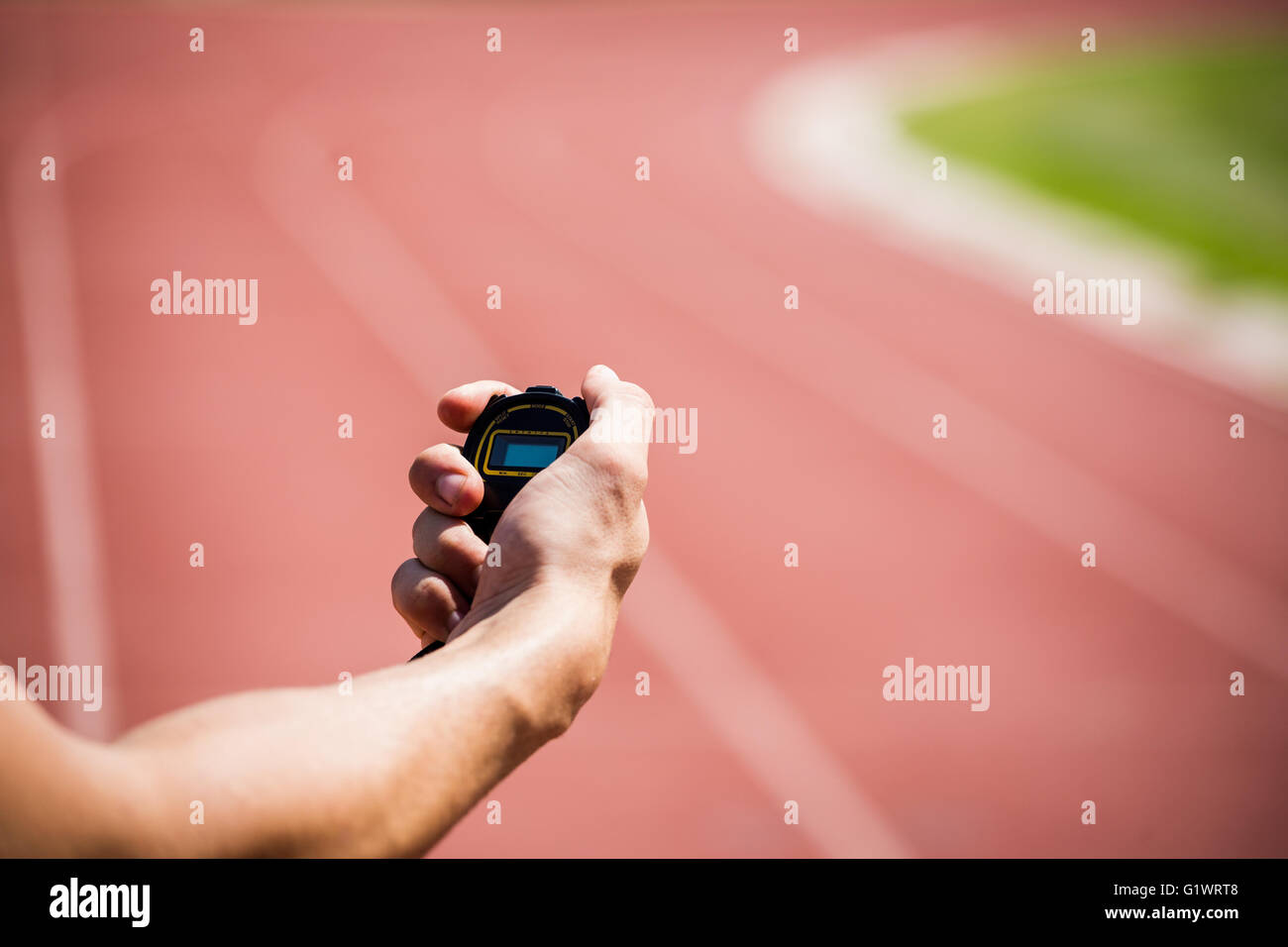 Hand holding stopwatch hi-res stock photography and images - Alamy