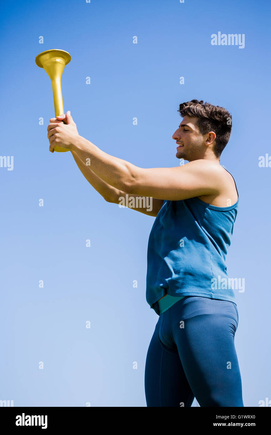 Male athlete holding olympic torch hi-res stock photography and images ...