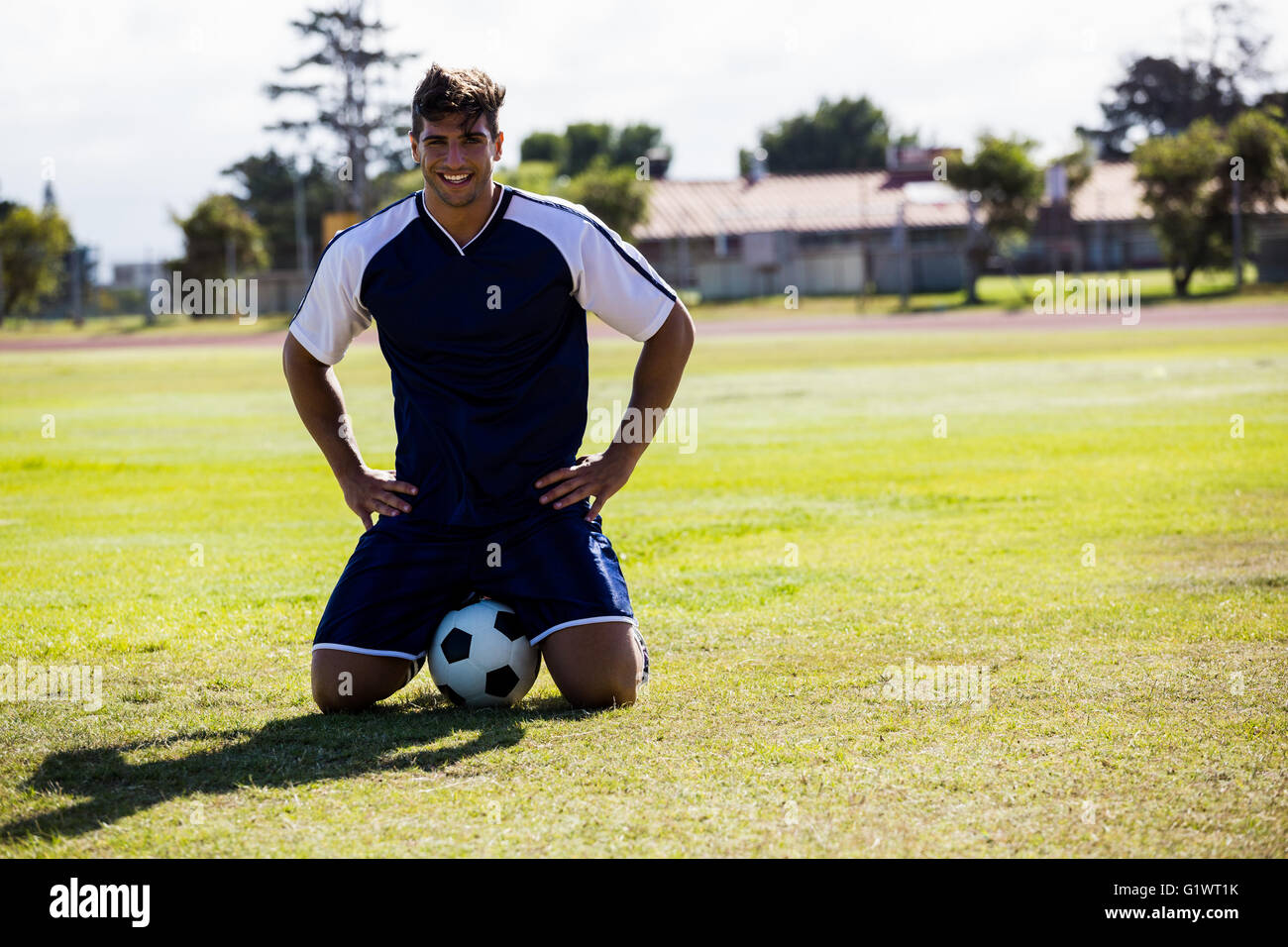 Portrait of football player with ball Stock Photo - Alamy