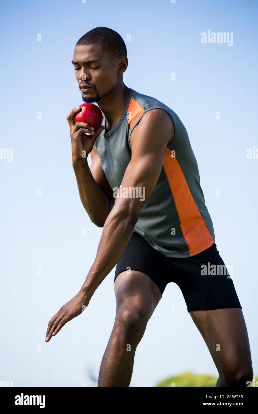 Athlete about to throw shot put ball Stock Photo - Alamy