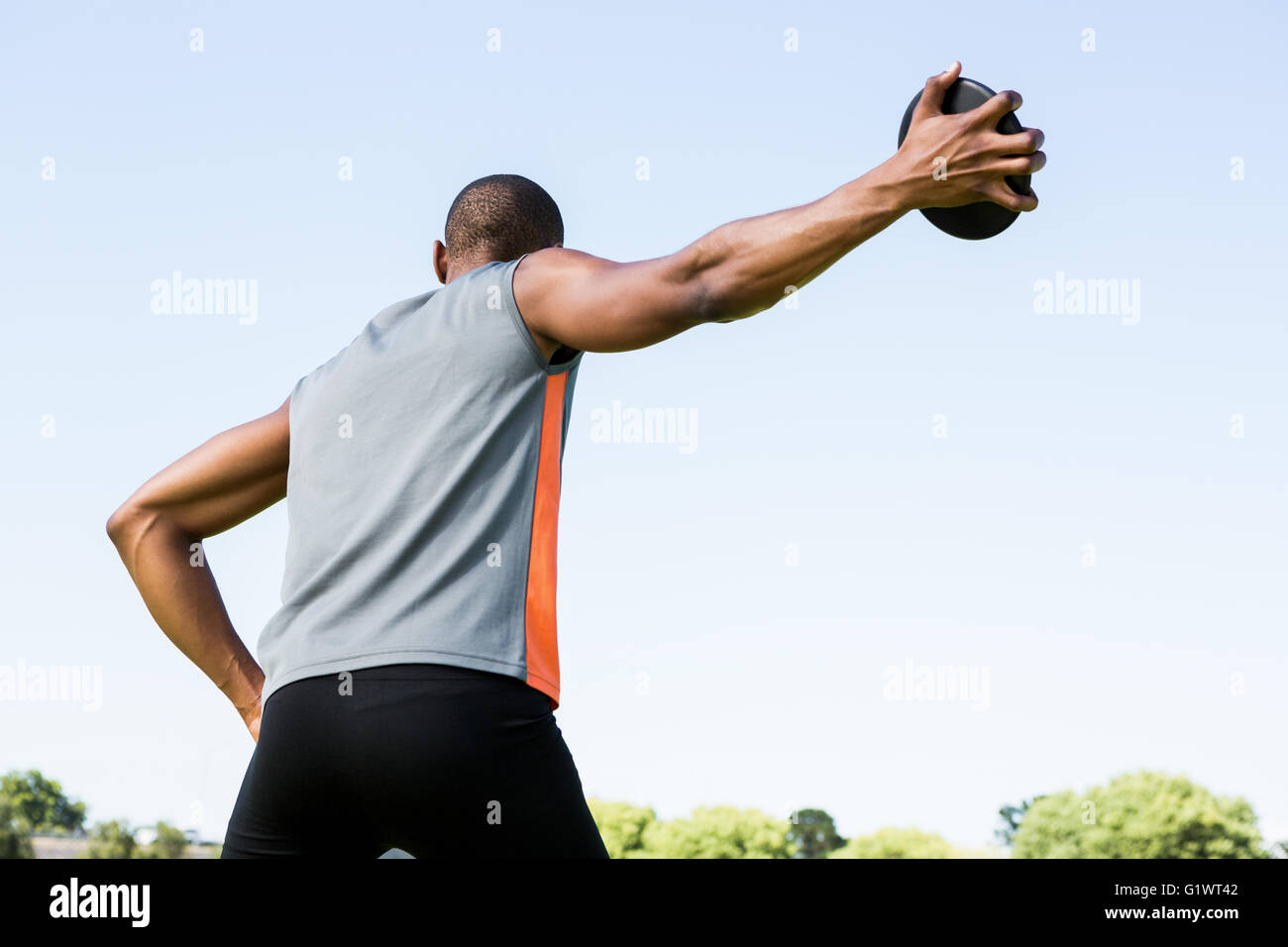 Athlete about to throw a discus Stock Photo - Alamy